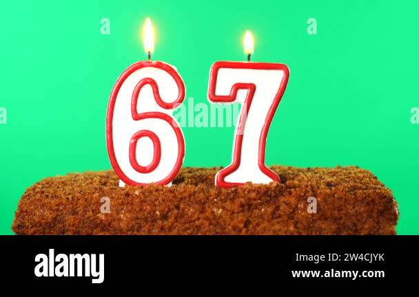 Cake with the number 67 lighted candle. Chroma key. Green Screen ...