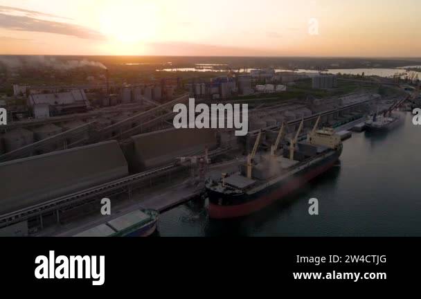 4K modern industrial port with containers from top or bird's eye view ...