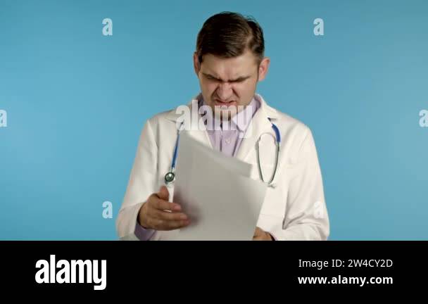 Angry doctor throws away papers. Furious male doc man throwing crumpled ...