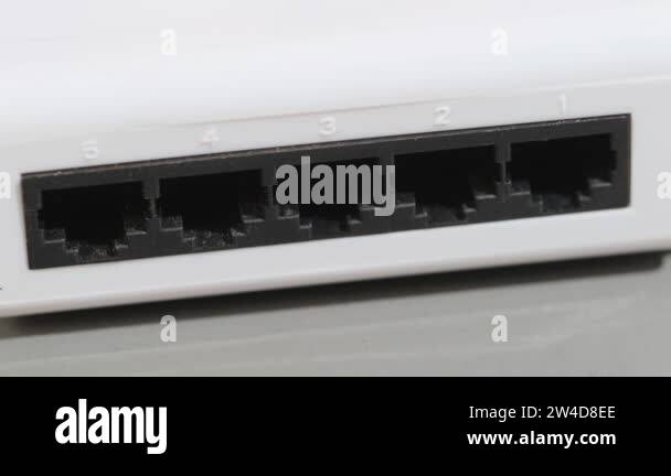 Male Hand Inserts The Blue Data Lan Cable rj45 Into Network Switch in ...