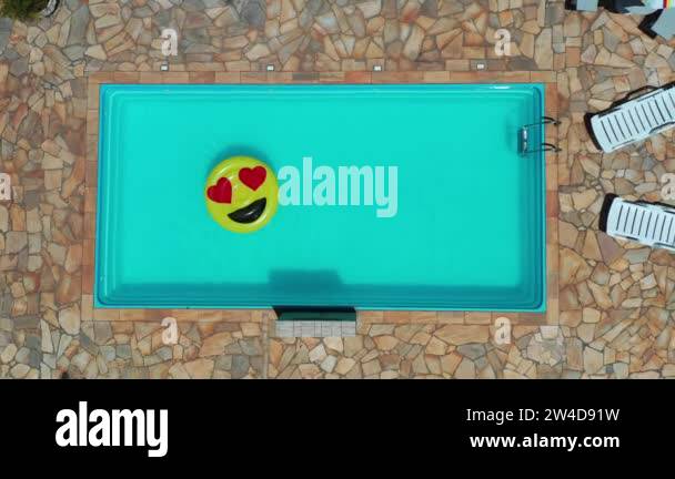 Mococa, Sao Paulo, Brazil. Smile emoji pool float scene at swimming ...