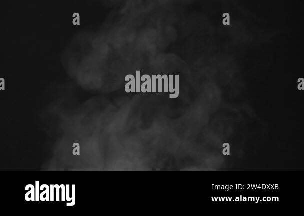 Water Vapor Slowly Rises from the Pan. White Steam rises from a large ...
