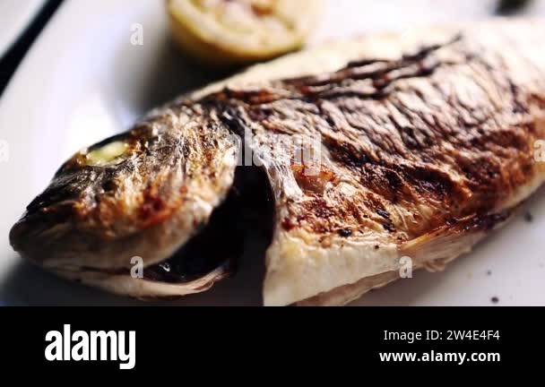 Sea bass cooked on plate Stock Videos & Footage - HD and 4K Video Clips ...
