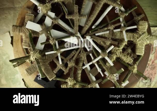 Different wooden crucifixes or cross on the table. Handmade religion ...