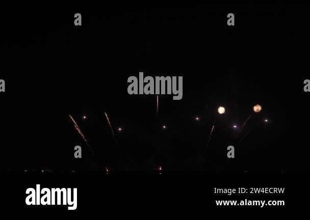 Golden big shiny fireworks with bokeh lights in the night sky. Glowing ...