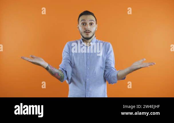 Puzzled man confused wondering asking how concept. Arms outstretched ...