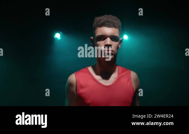 Portrait of young guy basketball player looking at the camera and ...
