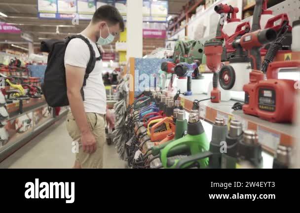 Customer look at the goods in diy shop, shopping in building ...