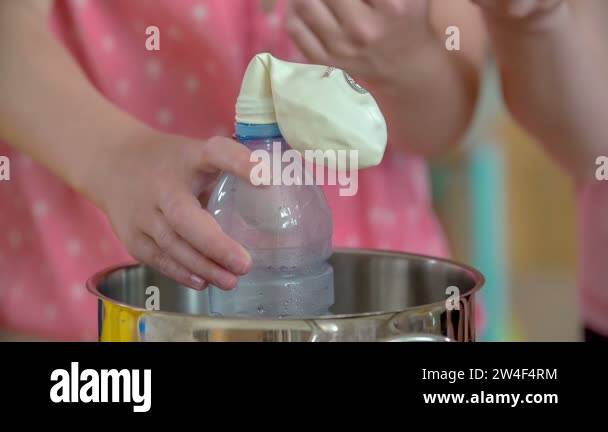 Students are trying to fill up a balloon with air. They are having a ...