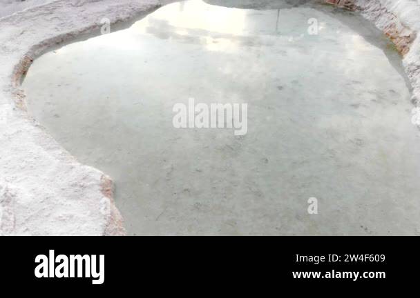 White travertine rock formed with calcium carbonate mineral in the ...