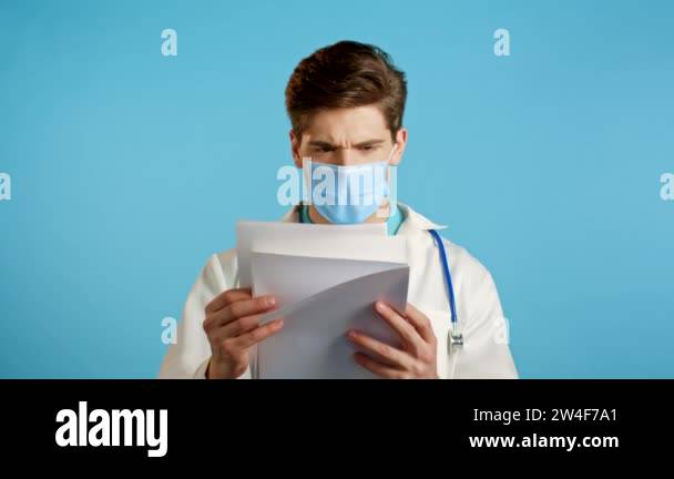 Angry tired doctor throws away papers. Furious male doc man throwing ...