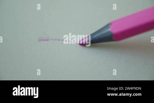 Purple graphite pencil color draws a straight line on a white ...