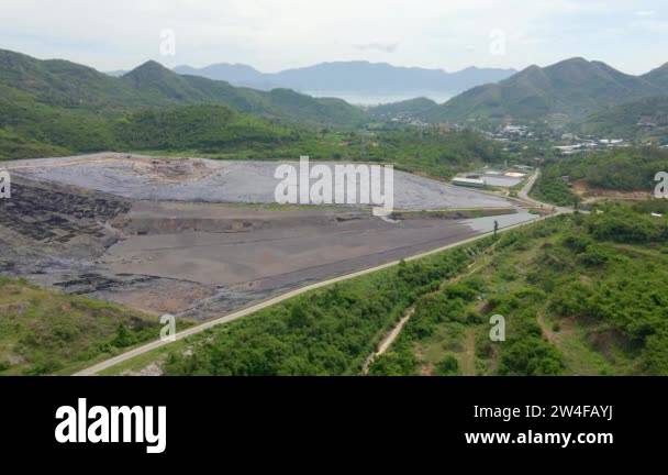 Aerial top view video of a solid waste landfill. City waste treatment ...