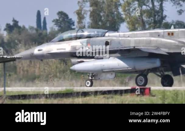 Two seats NATO grey military fighter jet for pilots training taxies on ...