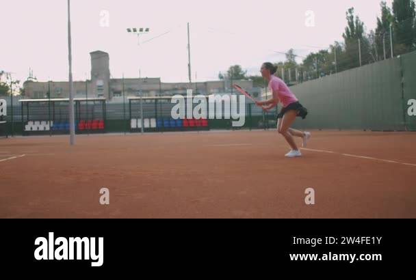 Attractive Athlete Poses Near Net In Tennis Court. Young athletic ...