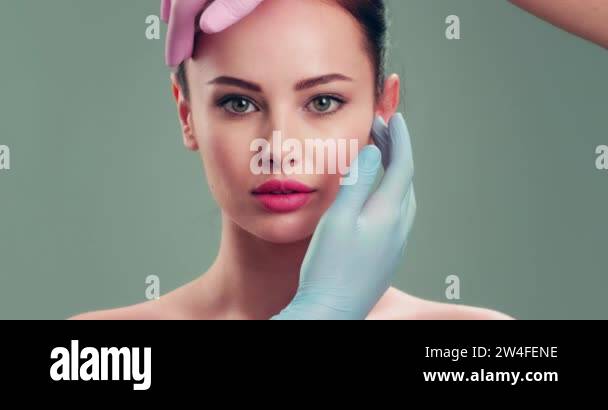 Slow motion clip - Doctor checks a skin before plastic surgery. Face ...
