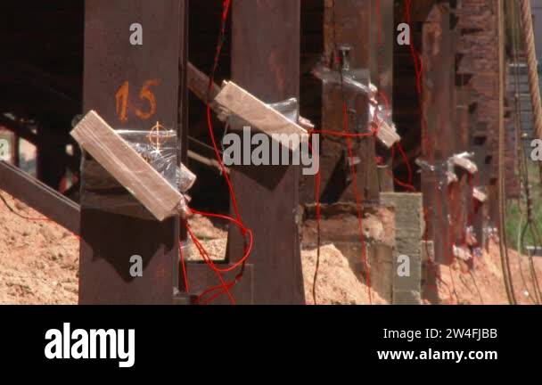 Mining of a metal structure with a red dynamite block TNT. Blasting ...