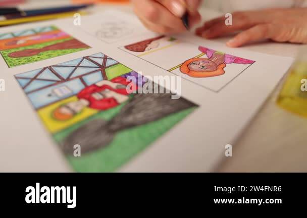 The animator artist draws in pencil a color storyboard for the cartoon ...