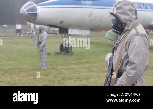 People in a suit that protects against biological weapons and ...