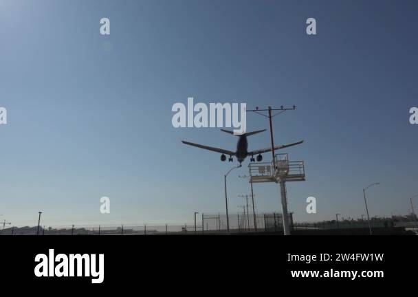 Jet airplane coming in for a landing directly overhead at Los Angeles ...