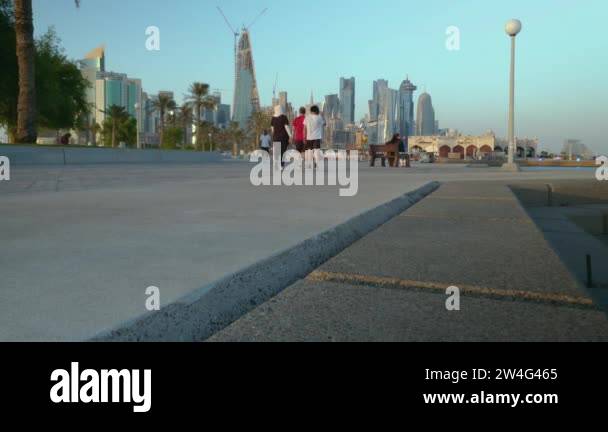Doha corniche In Doha Qatar low angle afternoon shot showing people ...