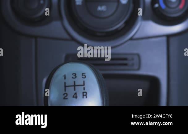 Shifting the gears of the car on a manual transmission. First, second ...