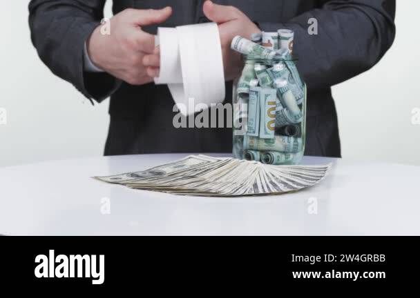 money, cash, business. close-up. man, in formal business suit, holds in ...