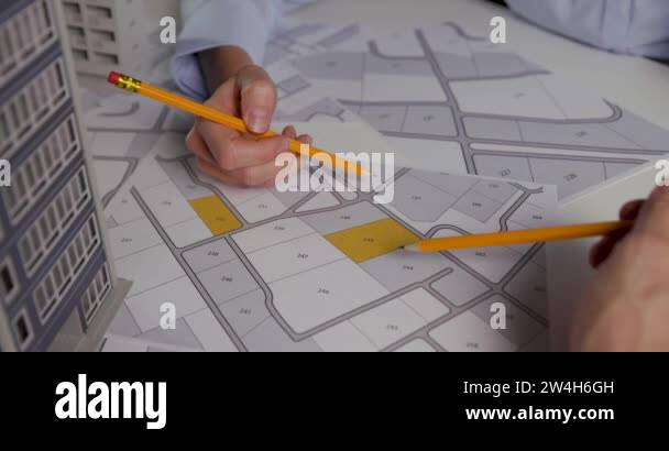 urban planning - businessmen discussing about territory building plots ...