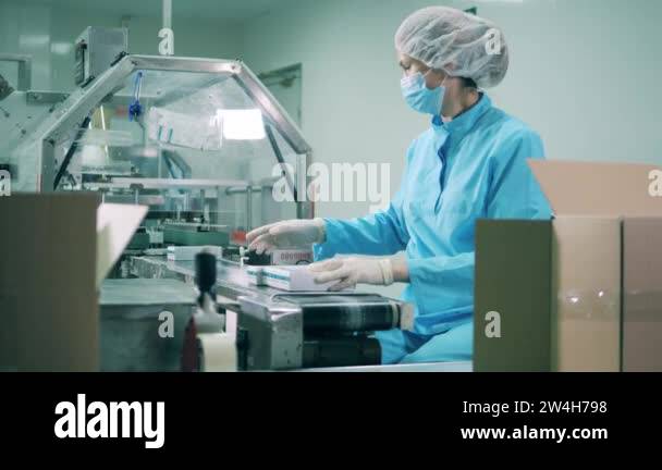 Drug packaging process. Health care, drugs production, pharmacist ...