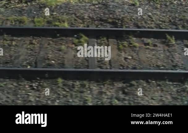 View on railroad tracks from the window of a fast train. Bullet train ...