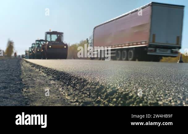 Close-up layer of freshly laid asphalt. Road surface repair ...