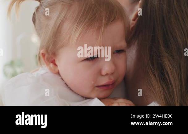 Close-up sad little child girl daughter baby infant crying with tears ...