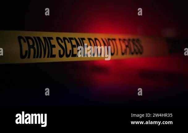 Police flashers light up the fencing tape at the crime scene Stock ...