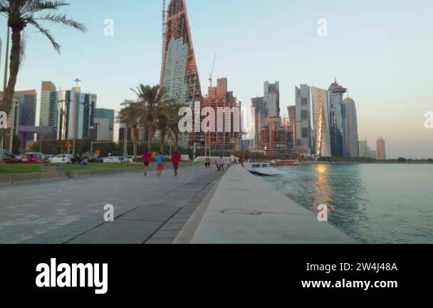Doha corniche in Doha Qatar afternoon shot showing people walking ...