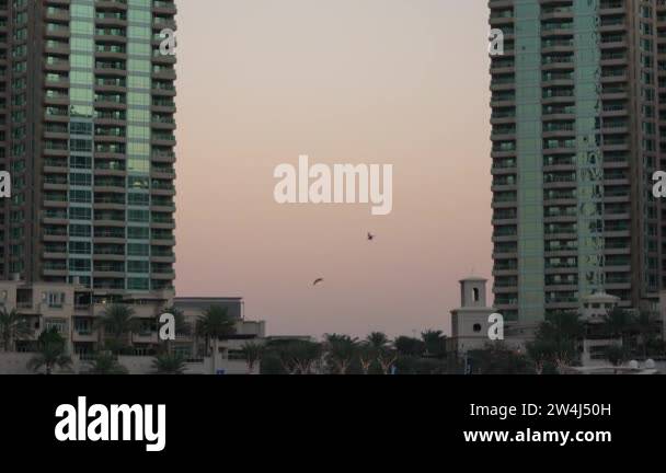 Tilt up of two identical towers at dusk Stock Video Footage - Alamy