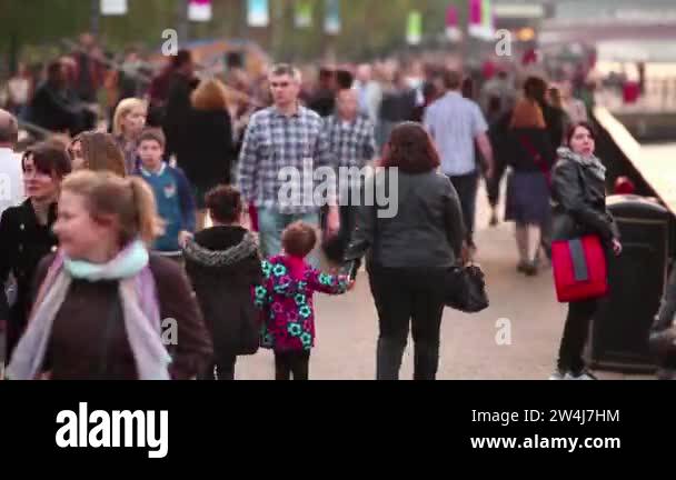 Crowd walking on Thames pavement in London Stock Video Footage - Alamy
