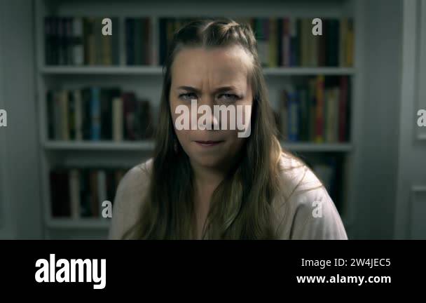 Adult lady with blue eyes is throwing a fist being outraged and very ...