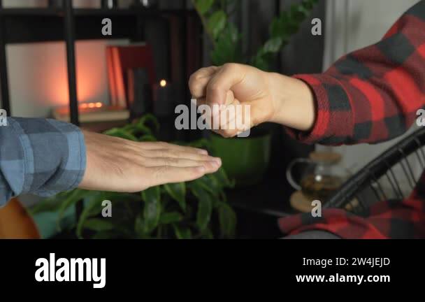 Woman and a man hands are playing rock, paper, scissors at home. Fun ...