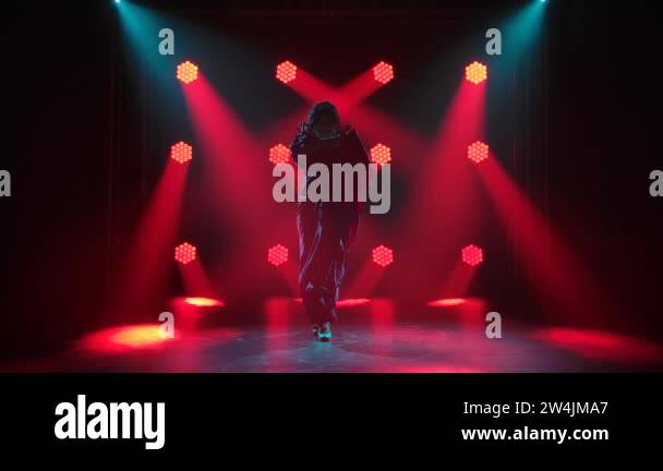 Flamenco. A passionate woman dances a fiery Spanish dance in a dark ...