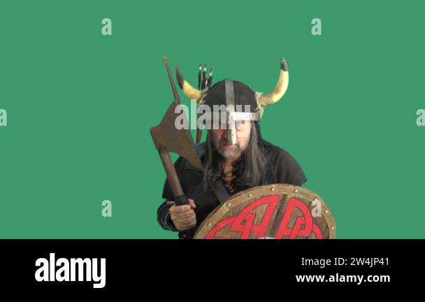 Portrait of mature male warrior, Viking in a helmet with horns, shouts ...