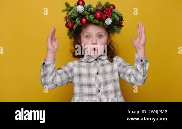Surprised cute little kid girl showing big size gesture with hands ...