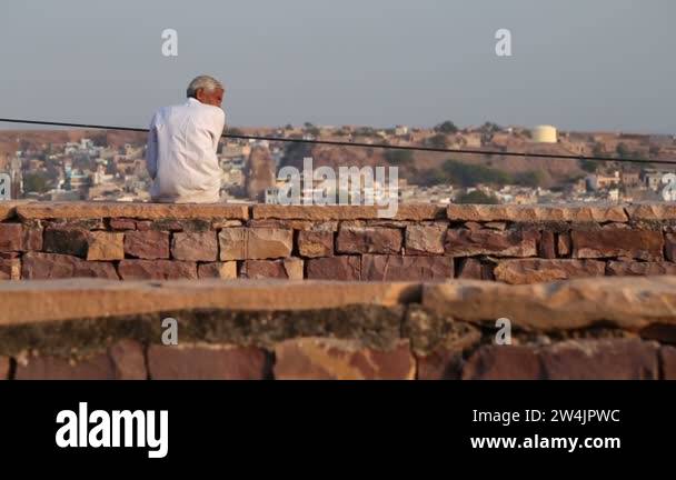 Man sitting on wall watching Stock Videos & Footage - HD and 4K Video ...