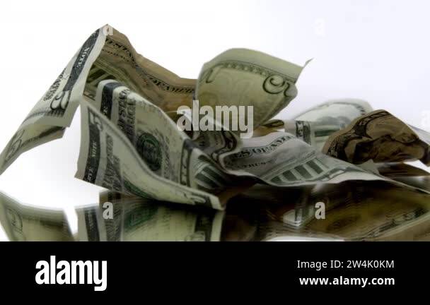 Crumpled american dollar banknotes bills rotating on isolated white ...