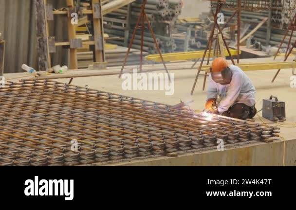 Welding metal construction. A welder welds a metal structure. Construction welder Stock Video ...