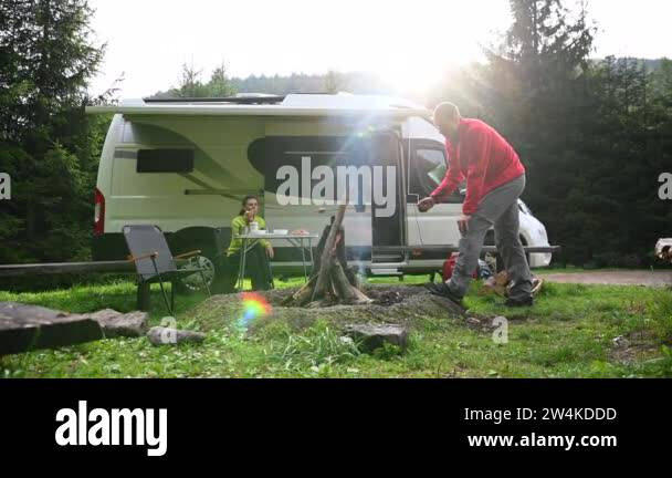 RV Recreational Vehicle Camper Van Road Trip and Camping with Campfire ...