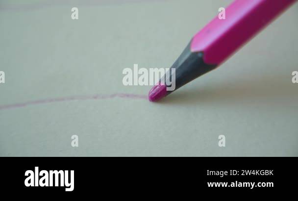 Purple graphite pencil color draws a straight line on a white ...