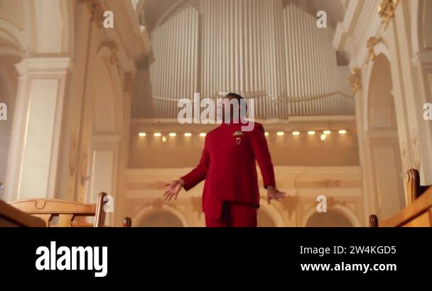 Emotional male singer performing worship music. Male Man wearing red ...
