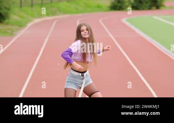 Young beautiful blonde woman dancing dancehall with twerking elements ...