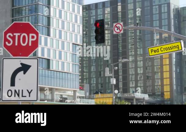Traffic light and caution sign, road intersection in USA ...