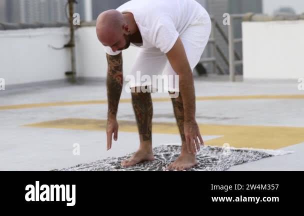 Man Stands Upright From Bending Forward And His Fingers Touching The ...